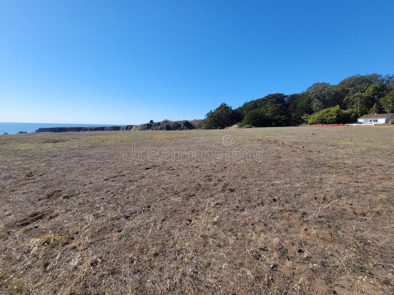Natural View of a Flat Field Next To the Ocean Stock Image - Image of ...