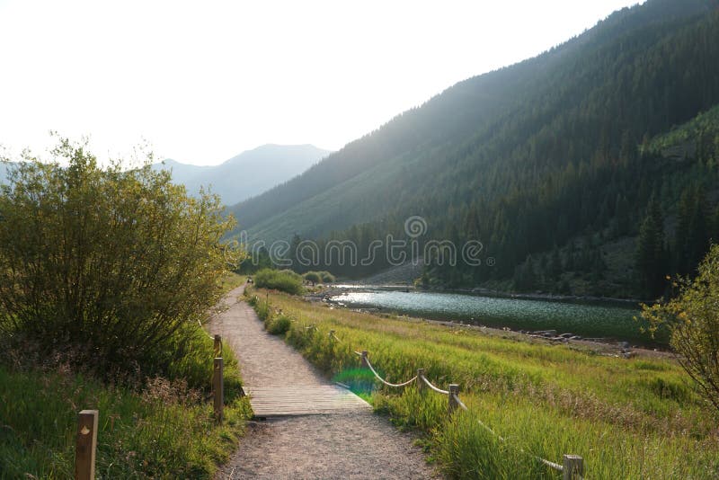 Natural View of a Pathway Near a Lake and Mountains Under a Bright ...