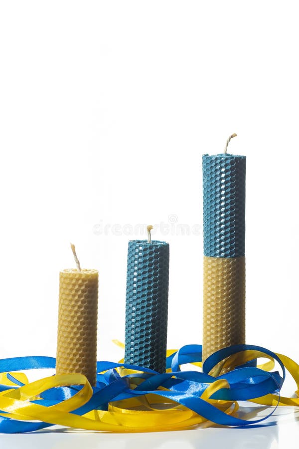 Natural Wax Candles, Yellow-blue Candles on a White Background Stock ...