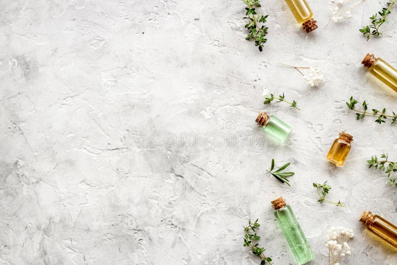 Natural Wellness. Essential Oils Near Herbs and Leaves on Light Grey ...