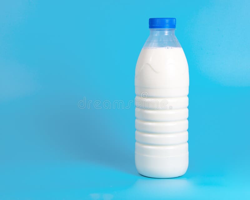 Natural White Milk in Plastic Bottle on Blue Background with Copyspace ...
