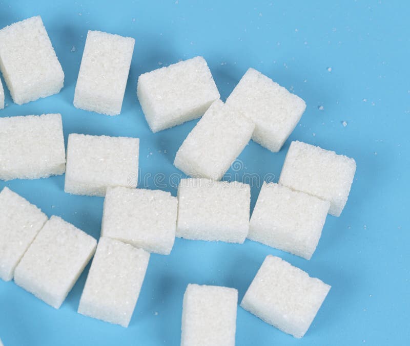 Natural White Sugar Cubes Isolated on Blue Background Stock Photo ...