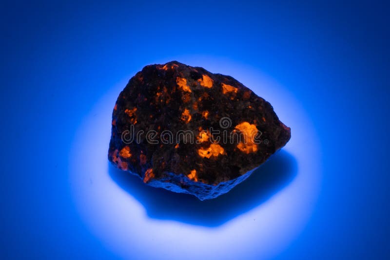 Natural Yooperlite Gem Stone in Uv Light on the White Background Stock ...