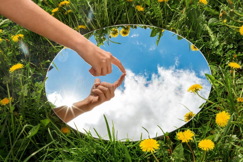 Hand Touching Sky Reflection in Mirror on Field Stock Image - Image of ...