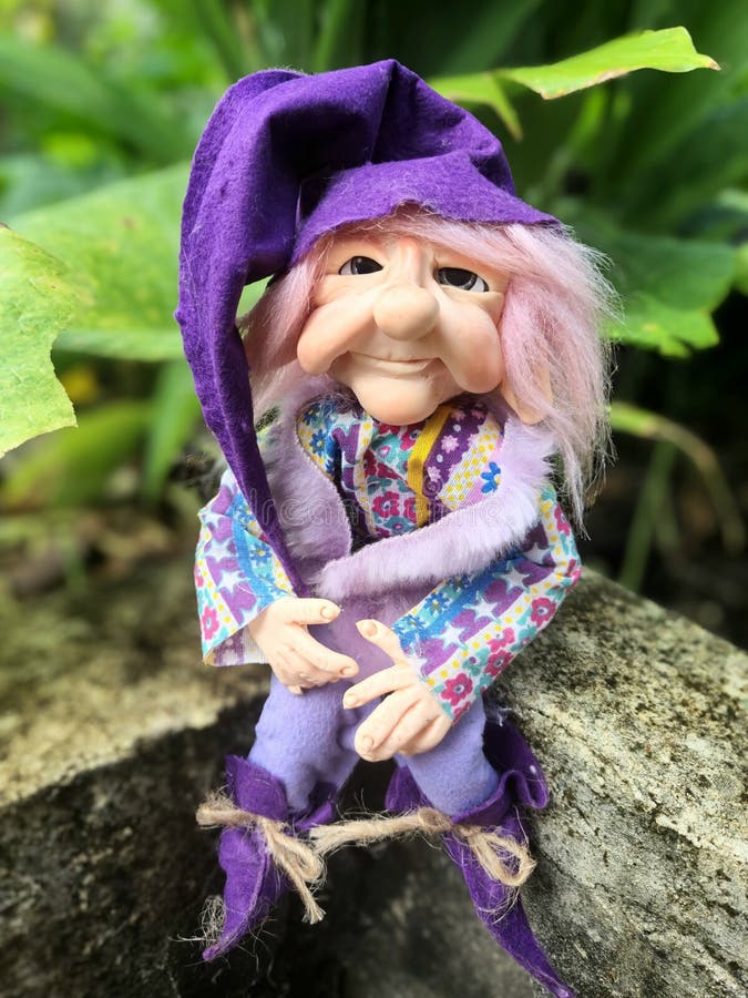 Nature Elemental Elf Sitting in Garden Bed at Dusk. Stock Image - Image ...