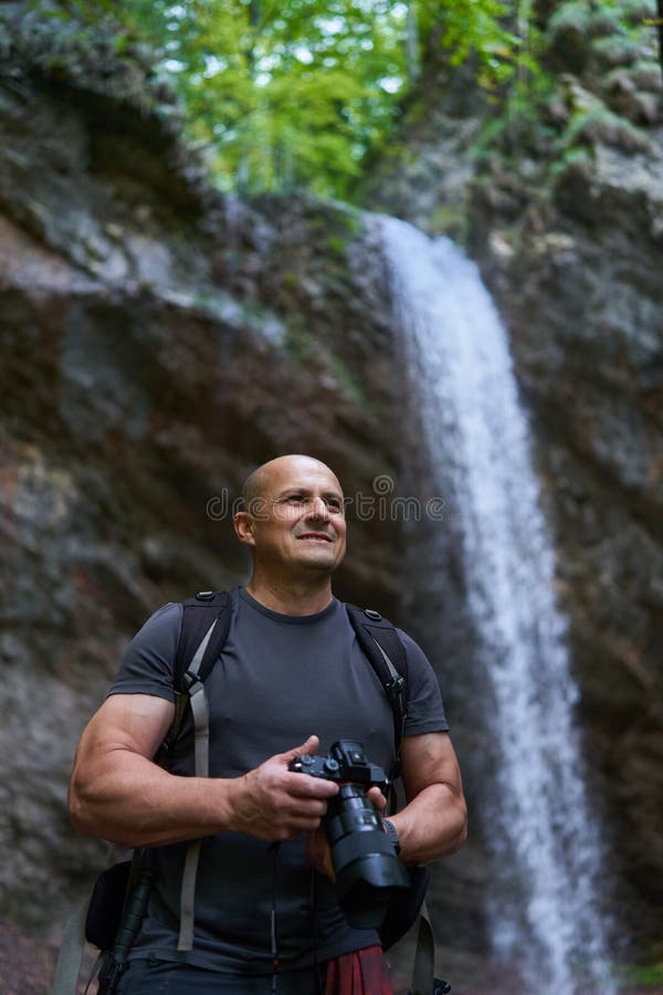 Nature Photographer with Camera by a Waterfall Stock Image - Image of ...