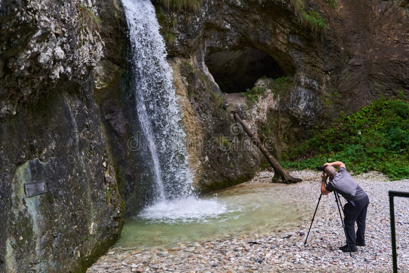 Nature Photographer with Camera by a Waterfall Stock Image - Image of ...