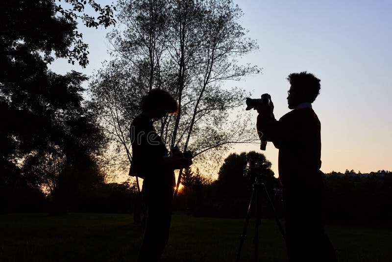 Nature Photographers with Cameras at Dusk Stock Image - Image of ...