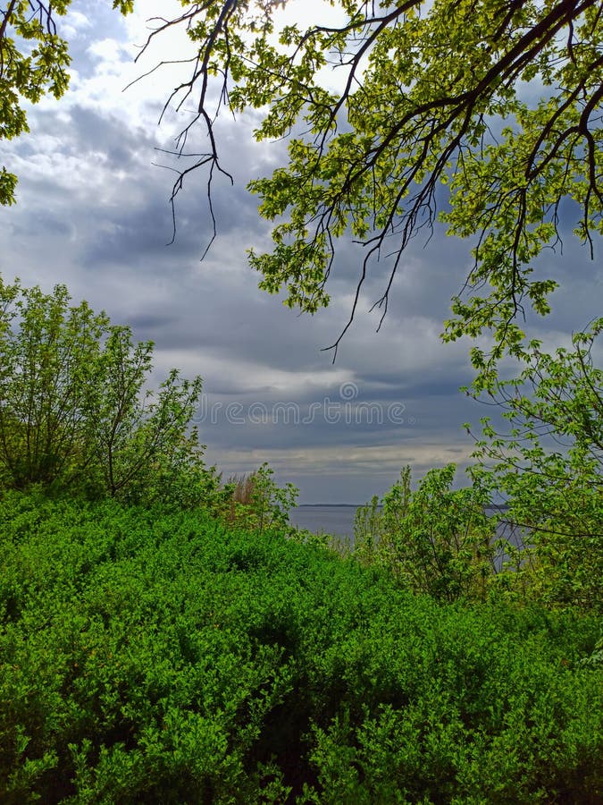 Nature before the Rain. Storm Clouds Over a Wide River Stock Photo ...