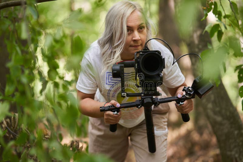 Nature Videographer in the Forest Stock Photo - Image of steadicam ...