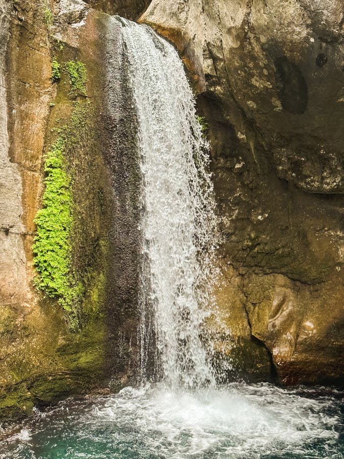 Nature Waterfall Scenery, Waterfall Flows Down a Rocky Cliff into a ...