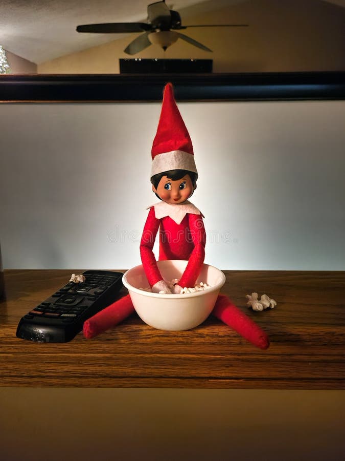 Naught Christmas Elf Eating Popcorn on Christmas Eve Stock Photo ...