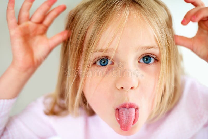 Naughty Young Girl Showing Her Tongue. Closeup Portrait of a Naughty ... Naughty Young Girl Showing Her Tongue. Closeup Portrait of a Naughty ...