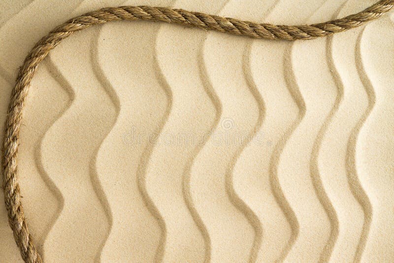 Nautical Background of Wavy Sand with a Rope Stock Photo - Image of ...