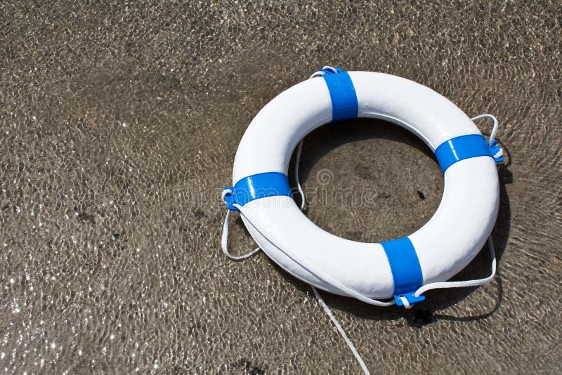Nautical Lifebuoy, Lifebelt, Life Saver in Clear Water Stock Photo ...