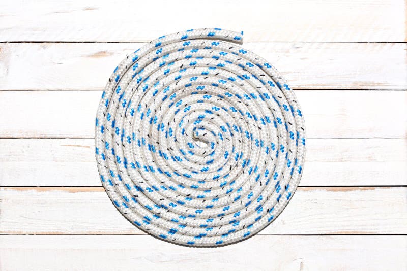 Nautical Rope in Spiral Shape on a White Wooden Deck with Copy Space ...