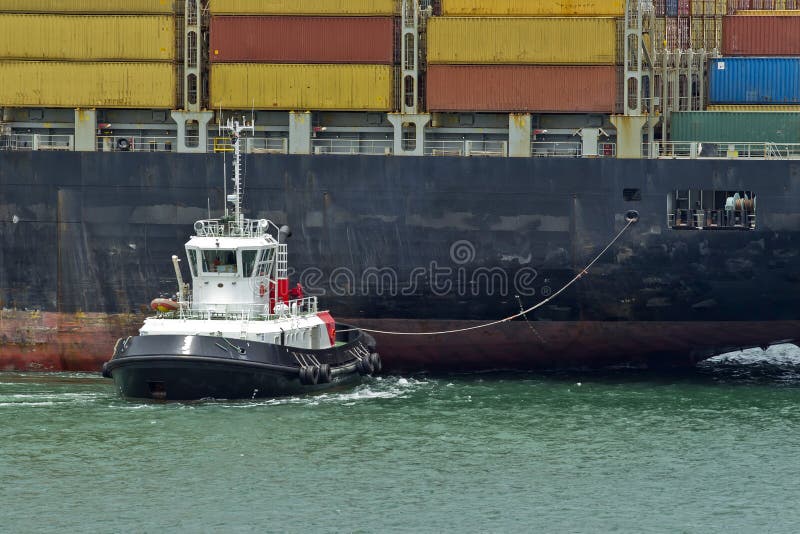 Naval Tug Moving a Container Ship Stock Photo - Image of ship, movement ...