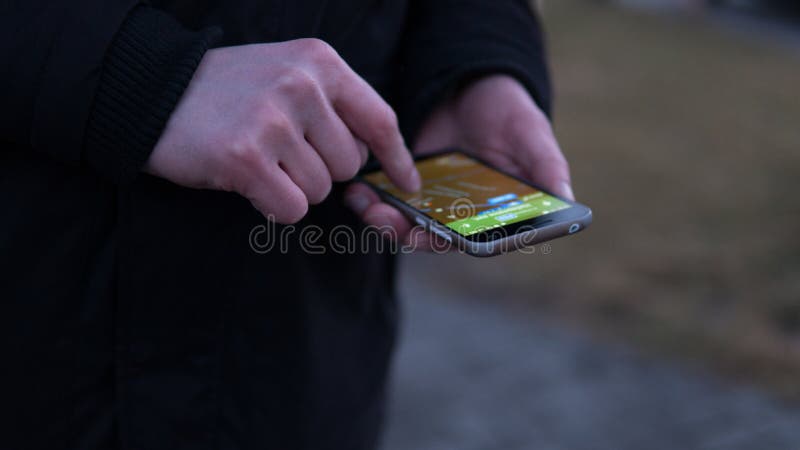 Navigating the City Using a Mobile Browser. Close-up of Hands of ...