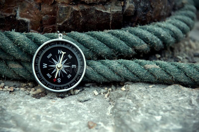 Navigation Compass in Harbor with Big Rope Around it Stock Photo ...