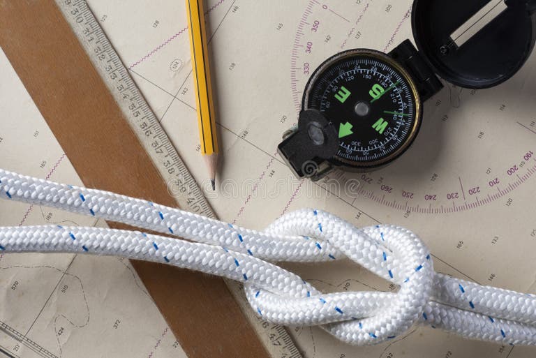 Navigation Tools on Nautical Chart with Compass and Rope Stock Photo ...