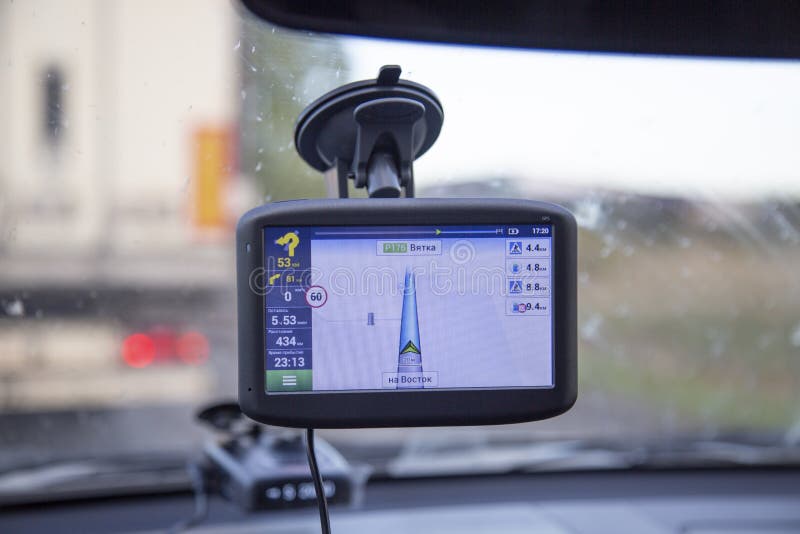 Navigator in the Car. Driving a Car Using the Navigator Stock Photo ...