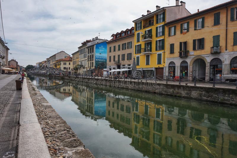 Navigli District and the Canals of Milan in the Summer. Fishermen Catch ...