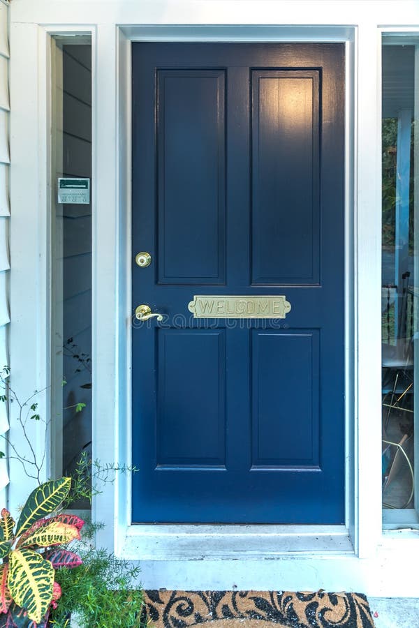 A Navy Blue Front Door of a Commercial Location Building with a Welcome ...