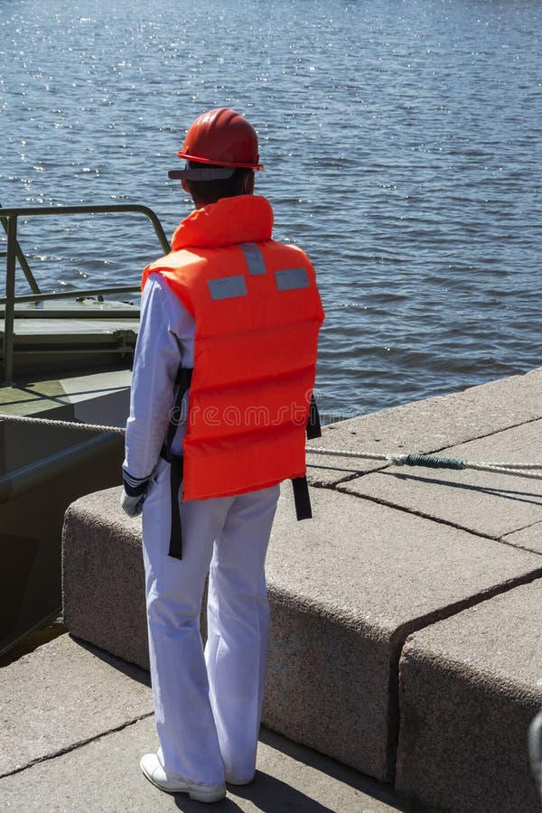 A Navy Sailor in a Dress Uniform and a Life Jacket Stock Photo - Image ...