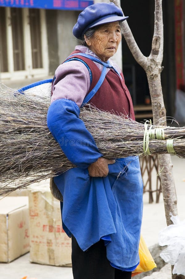 Naxi Woman Holding Bundle of Sticks Editorial Image - Image of chinese ...