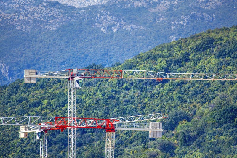 Cranes at work stock photo. Image of machinery, coastal - 136552362