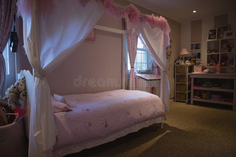 Neat Bedroom with a Bed and Nightstands with Lamps Stock Photo - Image ...