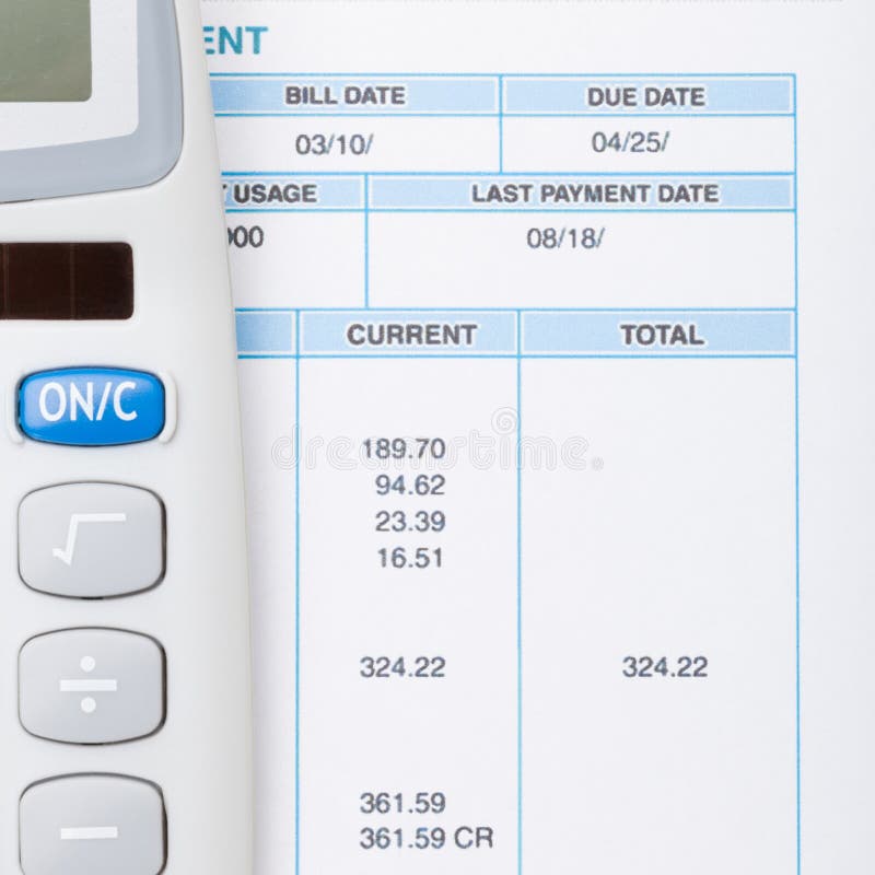 Neat Calculator and Utility Bill Next To it - Close Up Shot Stock Photo ...