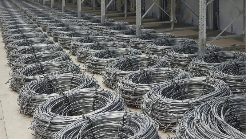 Neat Rows of Coiled Electrical Cables in a Warehouse with Metallic ...