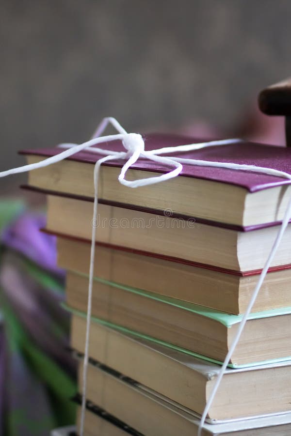 A Neat Stack of Books that are Tied Together Securely with a String ...