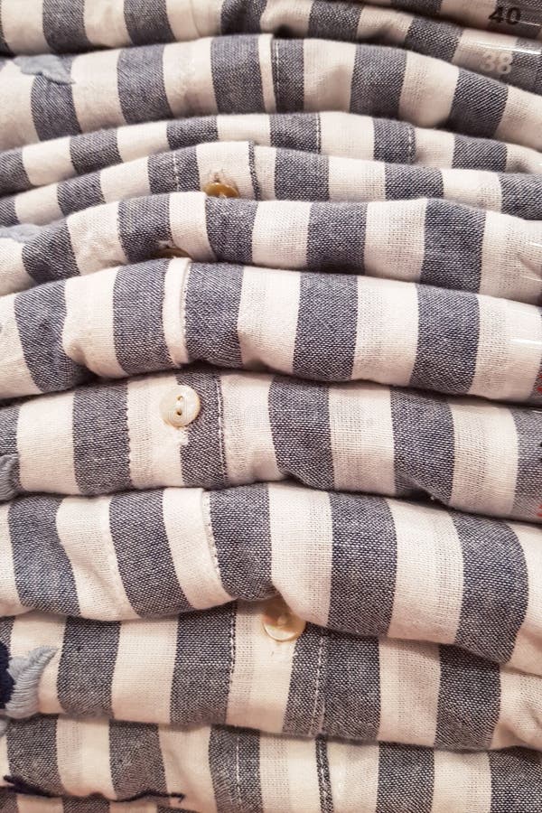 Neat Stacks of Folded Clothing on the Shop Shelves Stock Photo - Image ...
