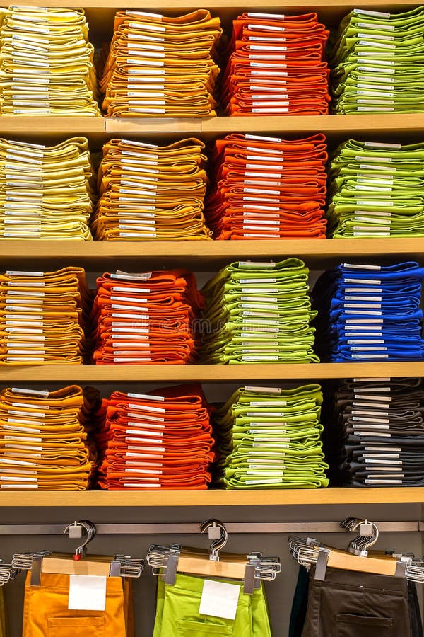 Neat Stacks of Folded Clothing Stock Image - Image of shelves, shirt ...
