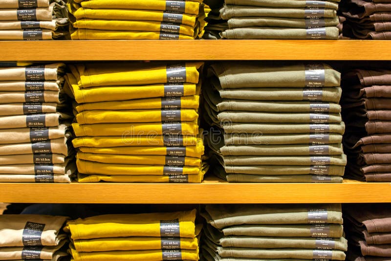 Neat Stacks of Folded Clothing Stock Photo - Image of fabric, buying ...