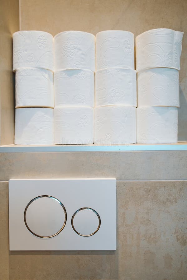 Stack of Toilet Paper Rolls in Bathroom with Modern Flush Button Stock ...