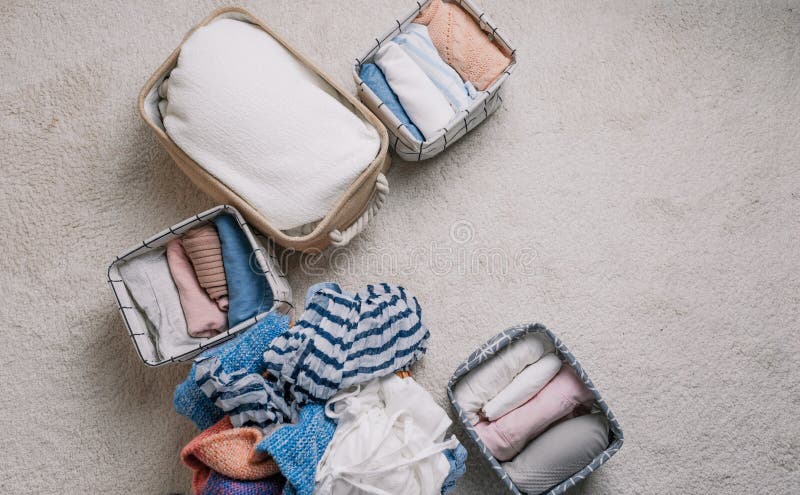 Neatly Folded Clothes in Open Organizer Boxes, Top View. Cleaning ...