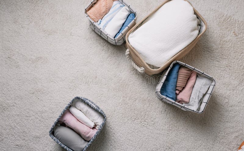 Neatly Folded Clothes in Open Organizer Boxes, Top View. Cleaning ...