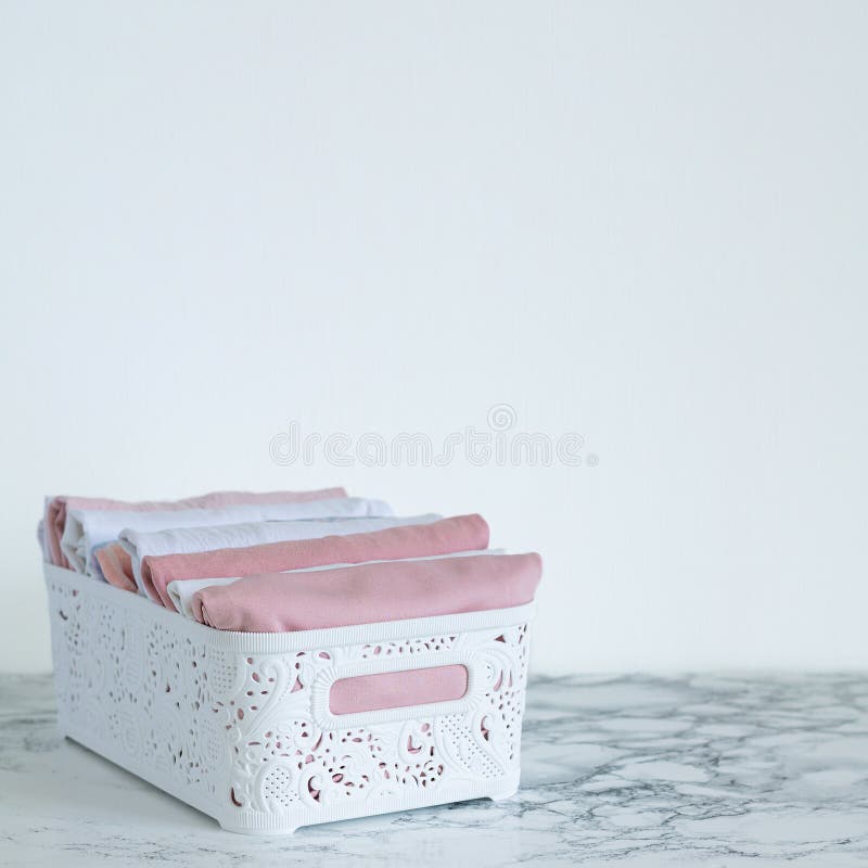 Neatly Folded Clothes in the Organizer Box for Wardrobe. Vertical ...