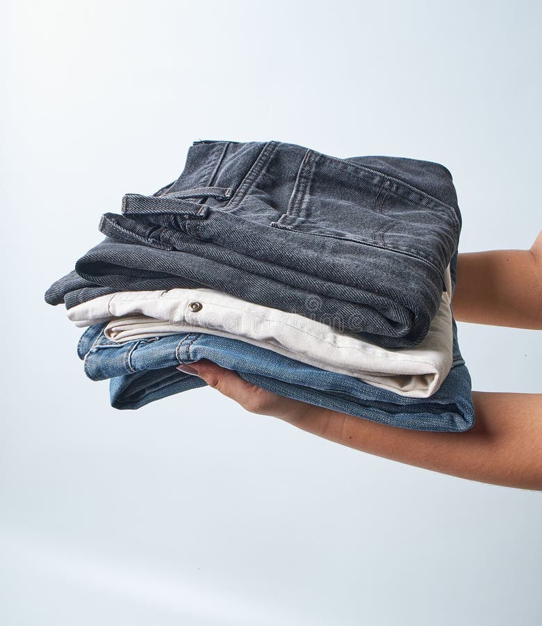 Folded Jeans Stacked Neatly Neutral Background Stock Photos - Free ...