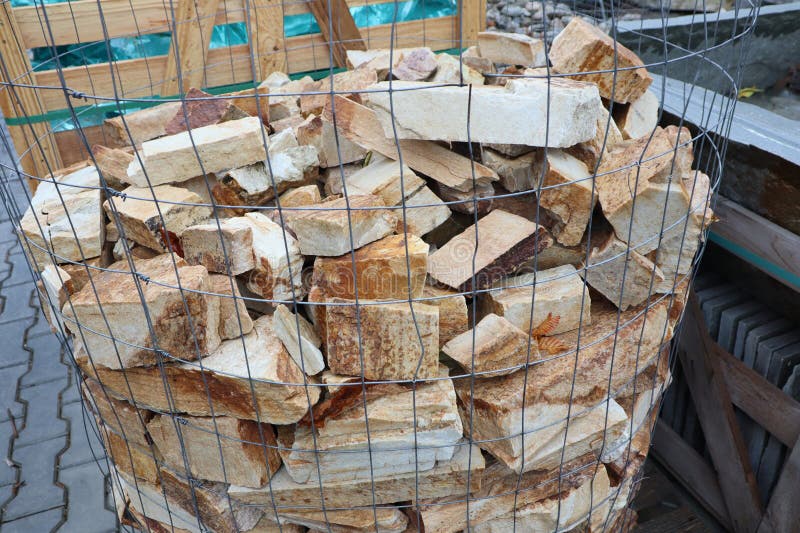 A Neatly Organized Stack of Firewood in a Wire Cage is Now Available ...