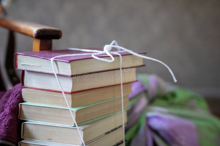 A Neat Stack of Books that are Tied Together Securely with a String ...