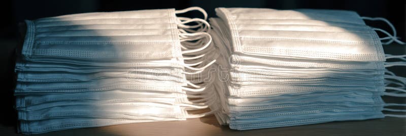 Neatly Stacked Disposable Masks Casting Shadows in a Well-Lit ...