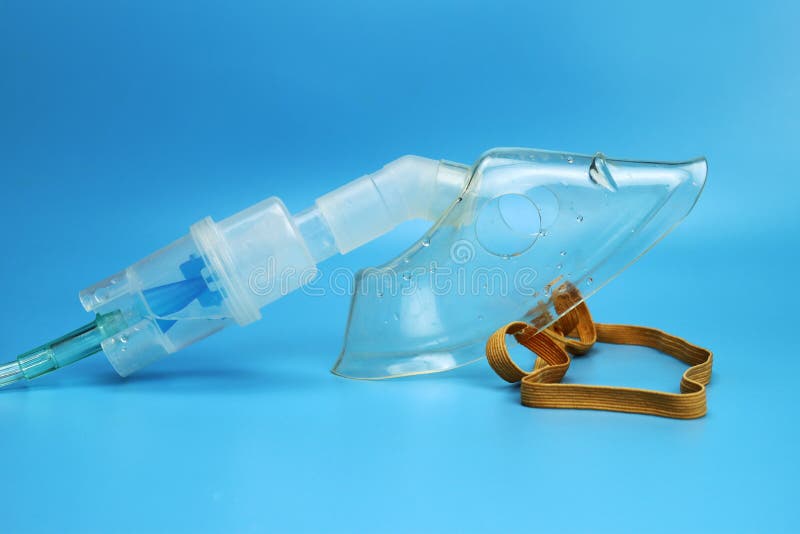 Nebulizer Inhaler Mask on a Blue Background Stock Photo - Image of ...