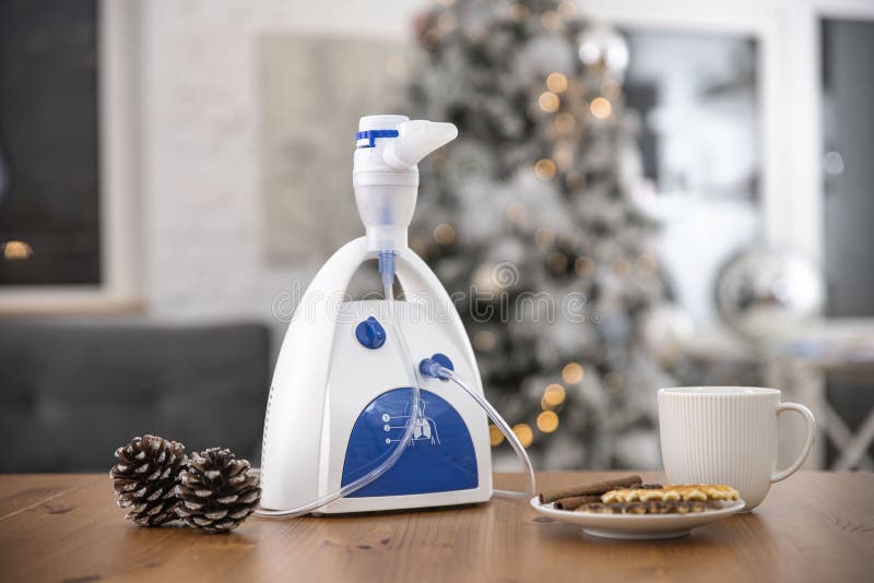 Nebulizer on the Table with a Cup and Fir Cones in the Room Stock Photo ...