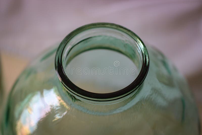 The Neck of a Huge Glass Jar on a Light Background Stock Image - Image ...