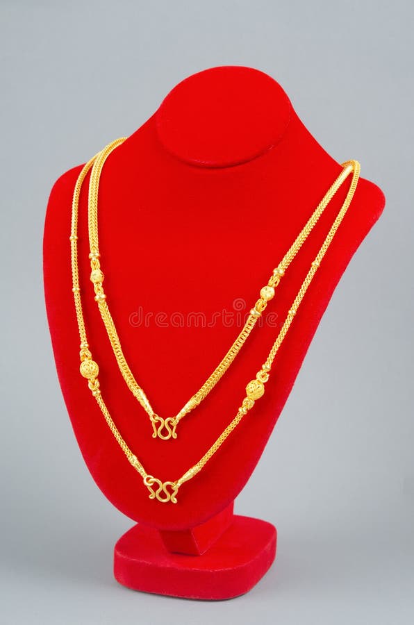 Necklace Display Stand with Gold Necklace Isolated on White Background ...