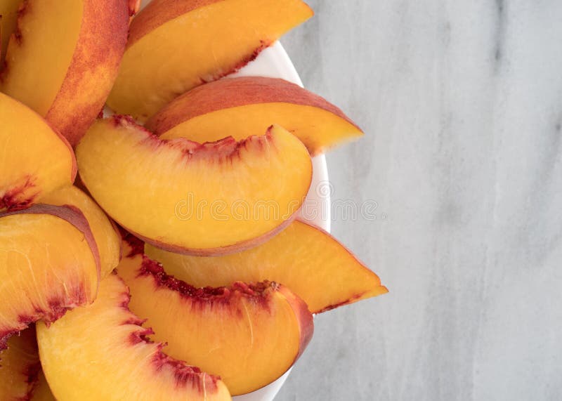 Nectarine Slices on a Plate and Marble Table Stock Image - Image of ...